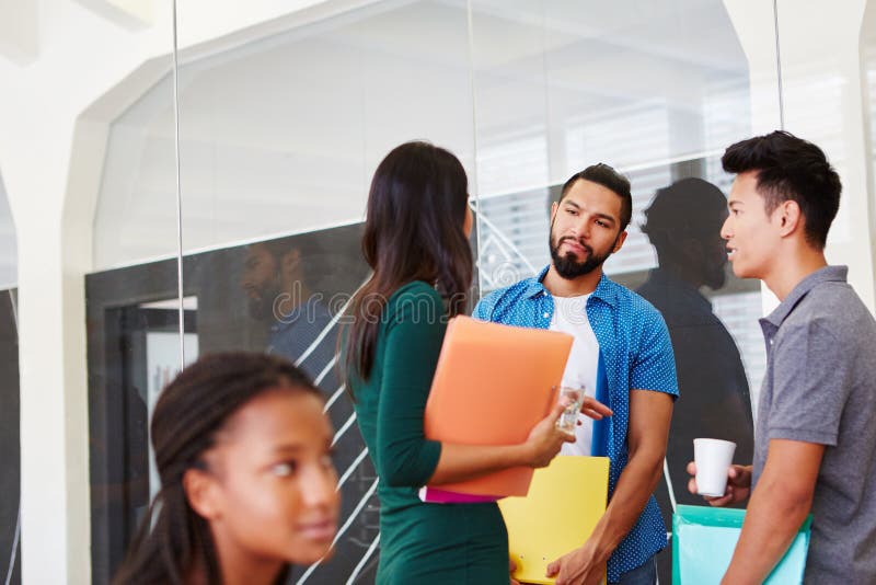 Start-up Team Speaks As a Group in the Office Stock Image - Image of ...