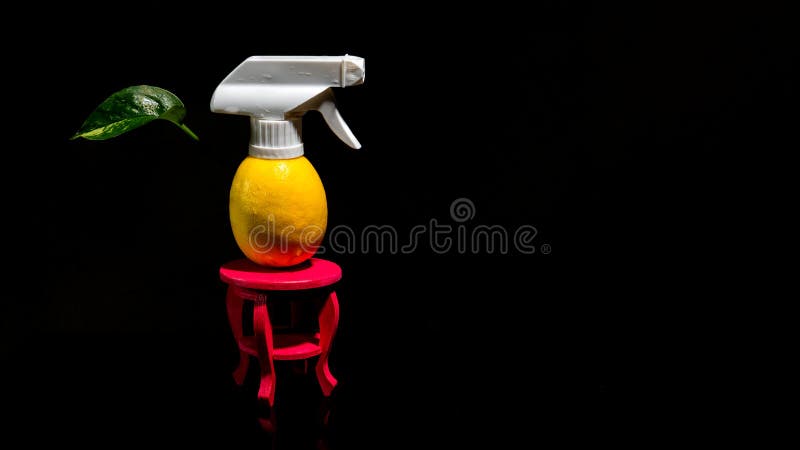Composition with Lemon and Spray on a Black Background Stock Photo ...