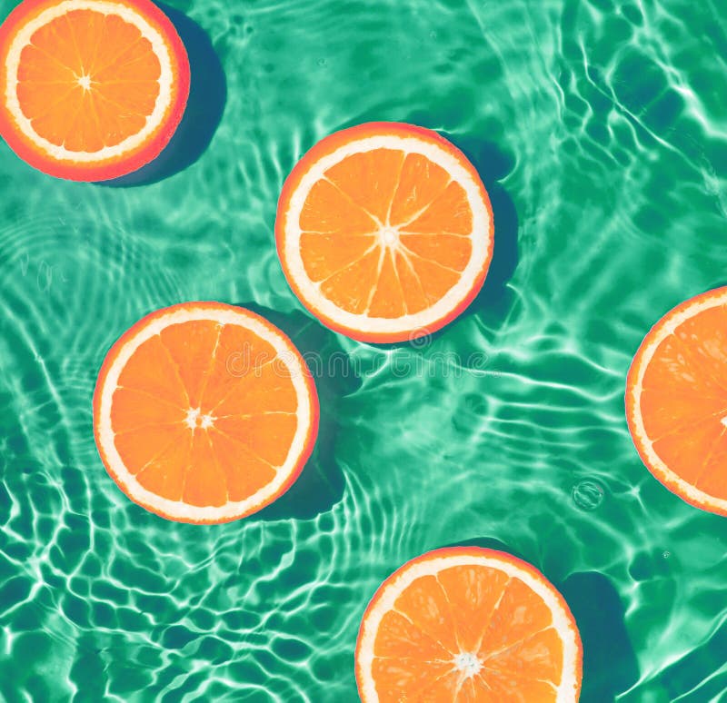 Creative Composition Made of Sliced Orange in Transparent Pool Water ...
