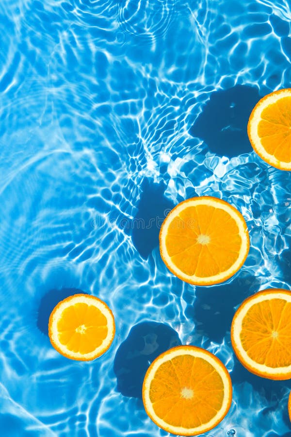 Summer Composition Made of Sliced Orange in Transparent Pool Water ...