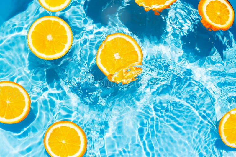 Creative Summer Composition Made of Sliced Orange in Transparent Pool ...