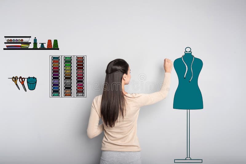 Creative Tailor Showing Her Colleague a New Sketch of a Dress Stock ...