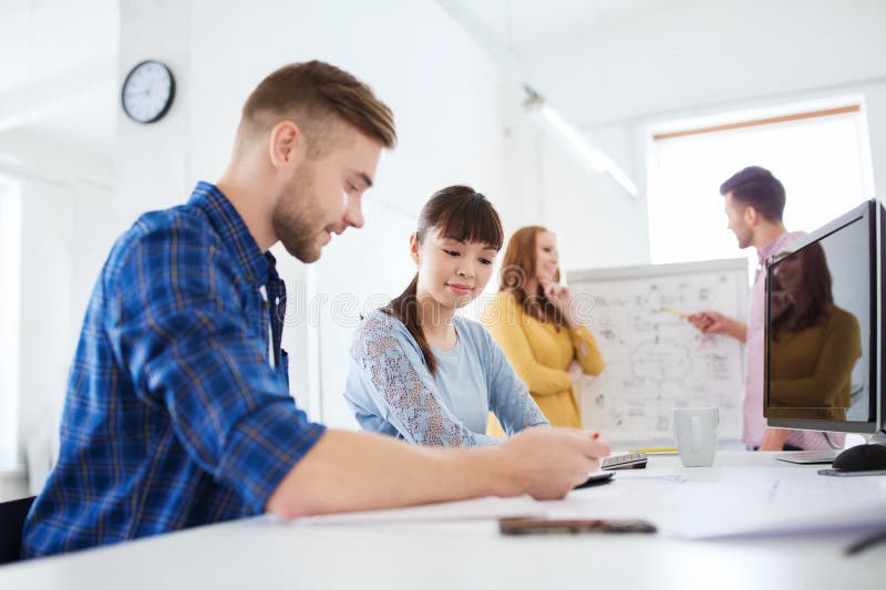 Creative Team with Blueprint at Office Stock Image - Image of person ...