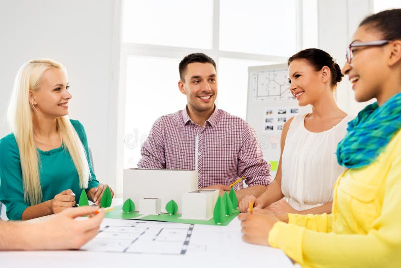 Creative Team with Blueprint Working at Office Stock Image - Image of ...