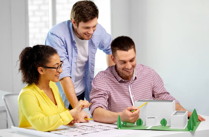 Creative Team with Blueprint Working at Office Stock Image - Image of ...