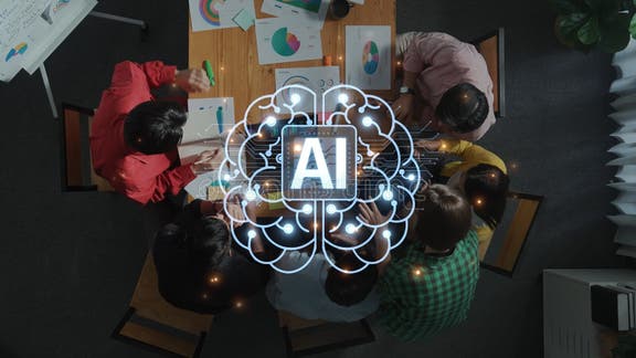 Creative Team Collaborating on Artificial Intelligence Project in ...