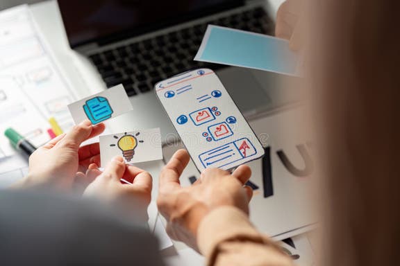 Creative Team Collaborating on UX UI Design with Wireframes and Ideas ...