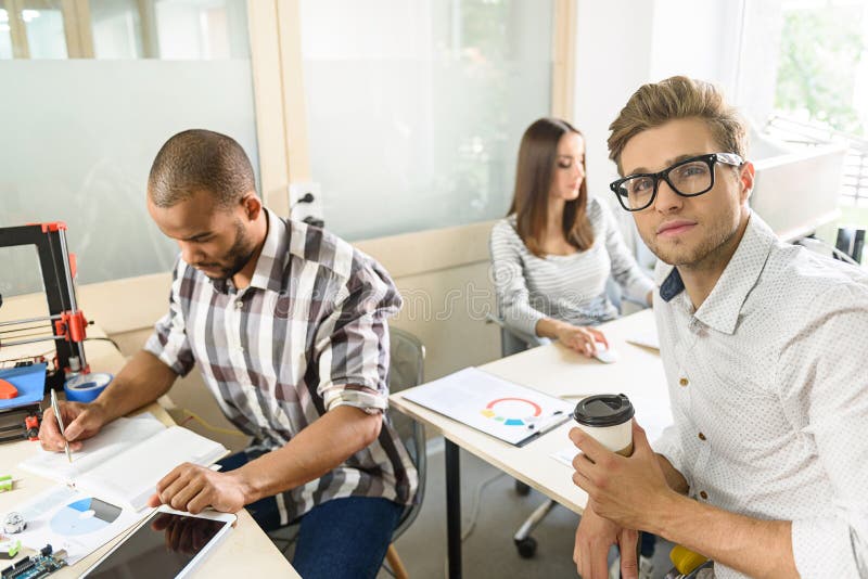 Creative Team Doing Cooperative Work Stock Image - Image of electronic ...