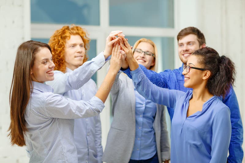 Creative Team Doing High Five Gesture in Office Stock Image - Image of ...