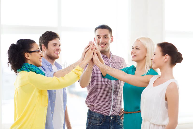Creative Team Doing High Five Gesture in Office Stock Image - Image of ...