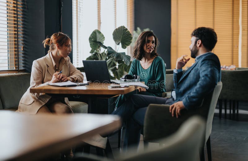 Creative Team Engaged in a Productive Meeting at a Bright Modern Office ...