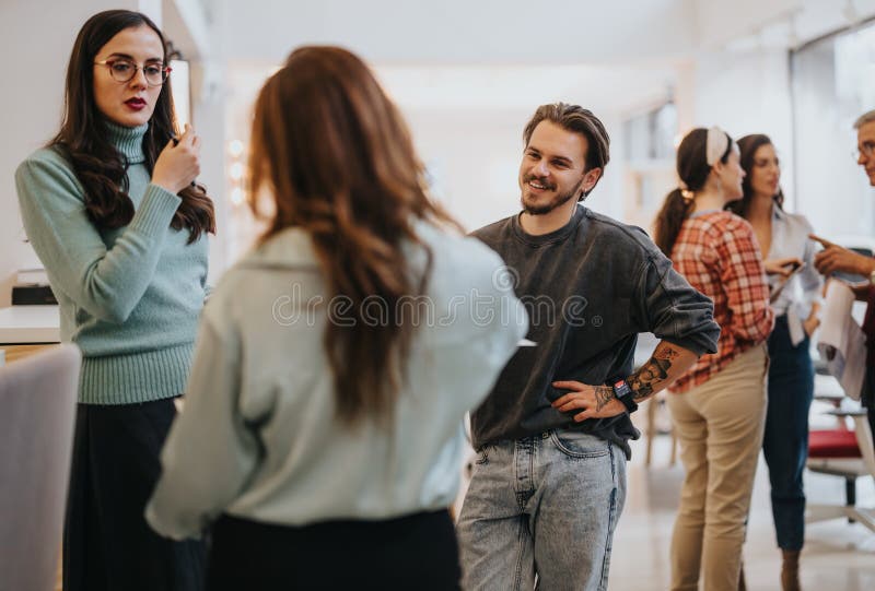 Creative Team Engaging in Informal Meeting in Modern Office Environment ...