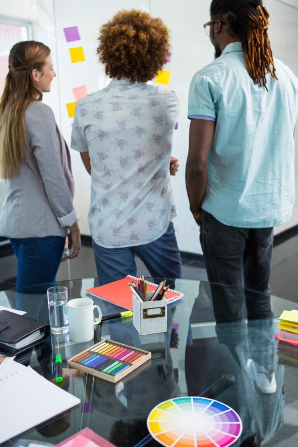 Creative Team Looking at Adhesive Notes Stock Photo - Image of career ...