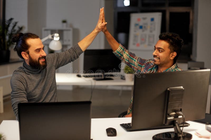 Creative Team Making High Five at Night Office Stock Photo - Image of ...