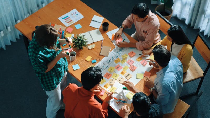 Creative Team Making Scrum Task Board while Using Sticky Note ...