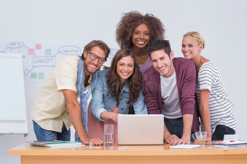 Creative Team Standing at Desk with Laptop Stock Image - Image of happy ...