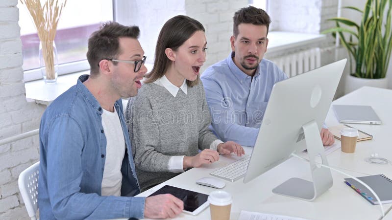 Creative Team Surprised by Results on Desktop Stock Image - Image of ...