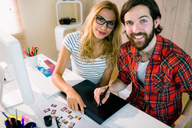 Creative Team Working at Desk Stock Image - Image of happy, colleagues ...