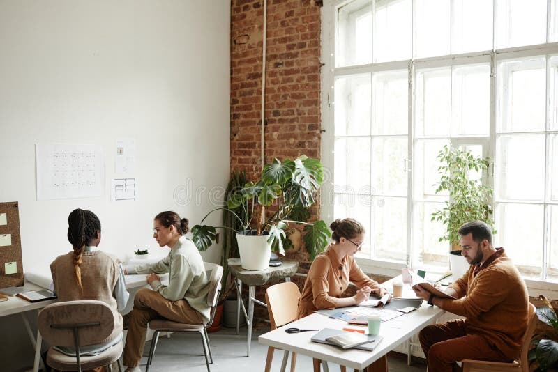 Creative Team Working in Sunlit Office Stock Photo - Image of team ...