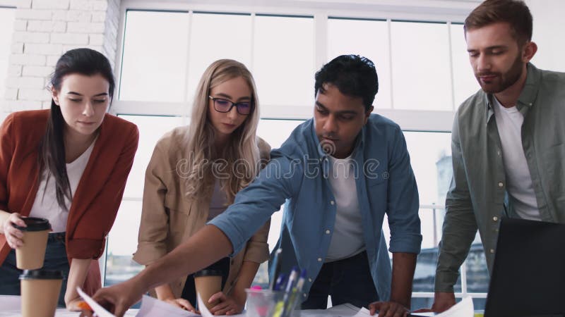Creative Team Working on Table. Creative Office Work. Team Discussing ...