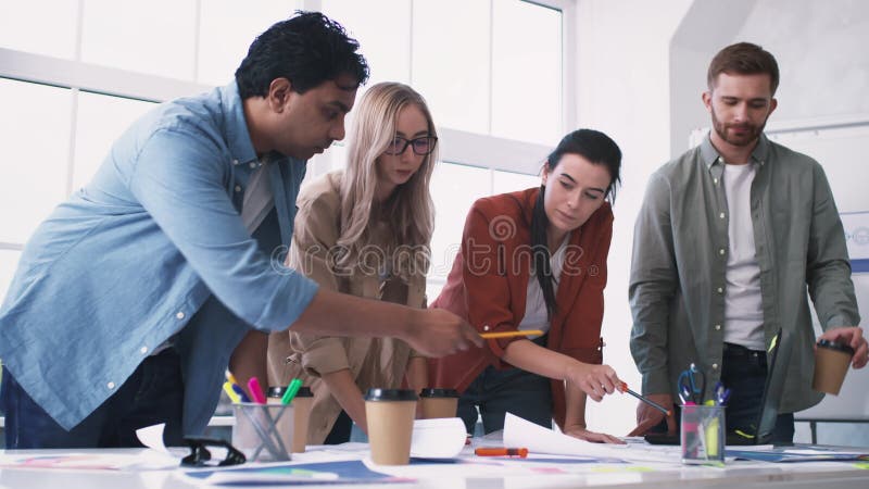 Creative Team Working on Table. Creative Office Work. Team Discussing ...