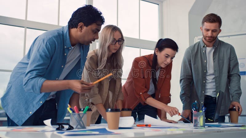 Creative Team Working on Table. Creative Office Work. Team Discussing ...