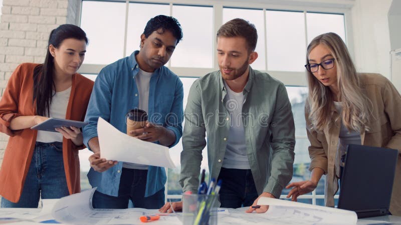 Creative Team Working on Table. Creative Office Work. Team Discussing ...
