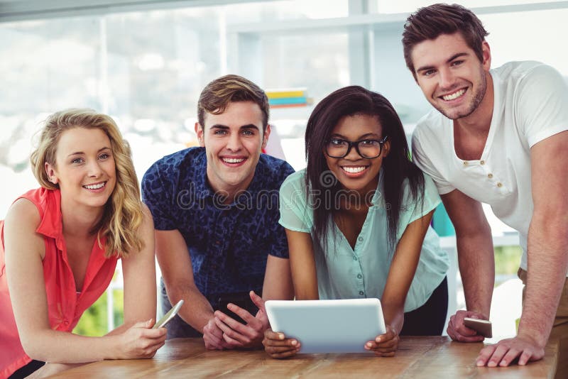 Creative Team Working Together on a Tablet Stock Photo - Image of ...