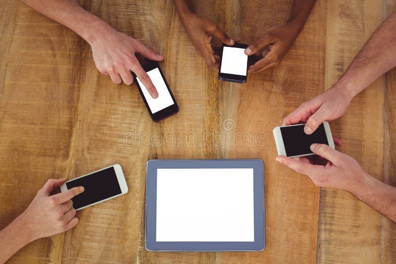 Creative Team Working Together on a Tablet and Smartphones Stock Photo ...