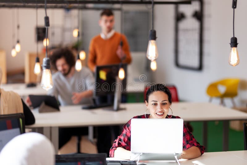 Creative Team of Young Individuals Working on Desktop Computers in a ...