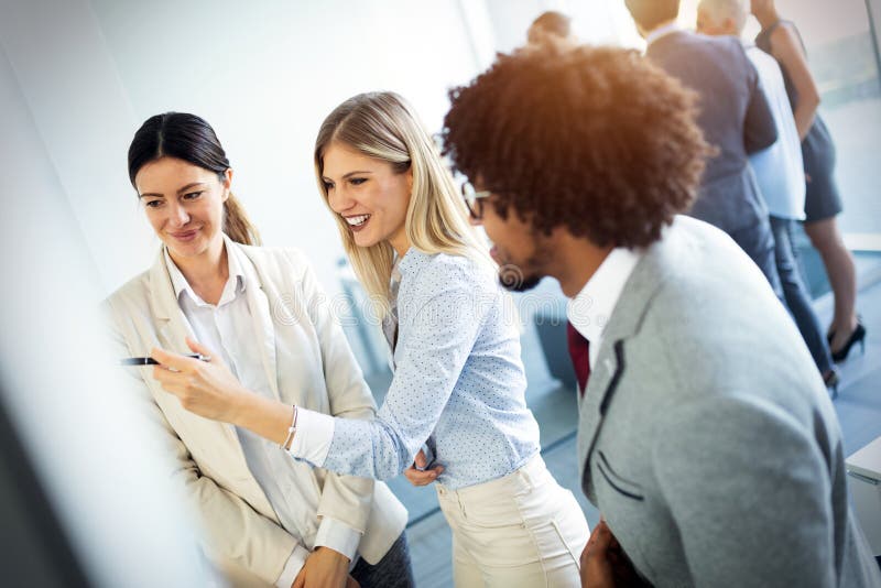 Creative Teamwork in Front of Glass Wall Using Post it Notes and ...
