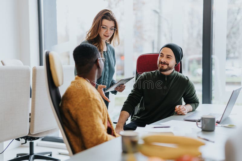 Diverse Team Collaborating in Innovative Office, Discussing Strategies ...