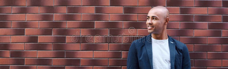Creative Thinking. Young Guy Standing Leaning on Wall Smiling Happy ...