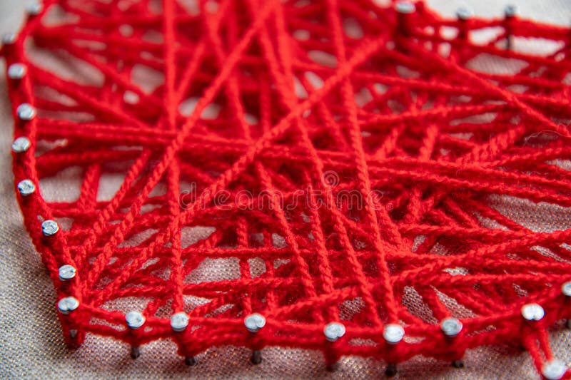 Intricate Red String Art Created with Nails and Yarn Revealing Layers ...