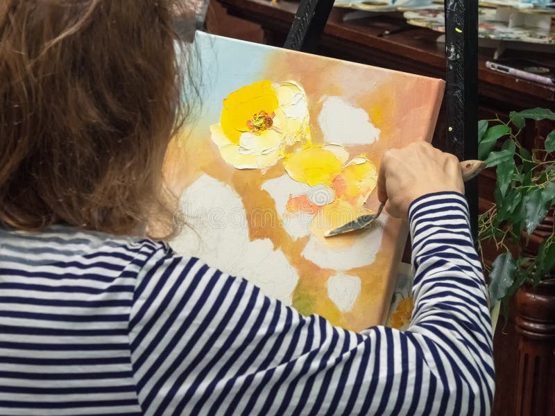 Creative Woman Drawing Texture Paste, Working with a Spatula, Creating ...