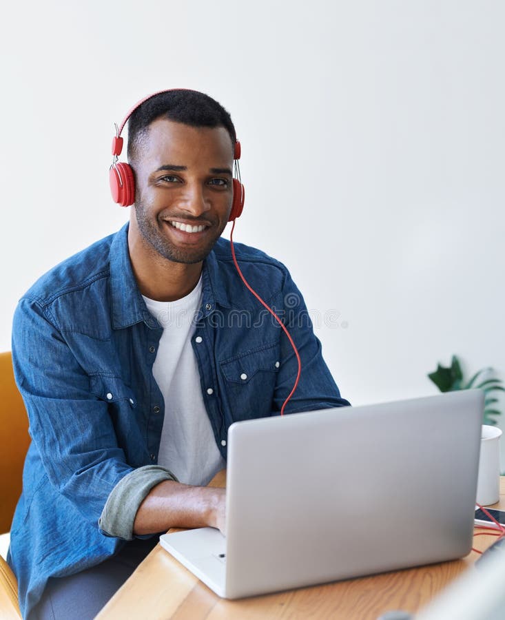 Creative Work is Enhanced by Some Great Tunes. a Handsome Casually ...