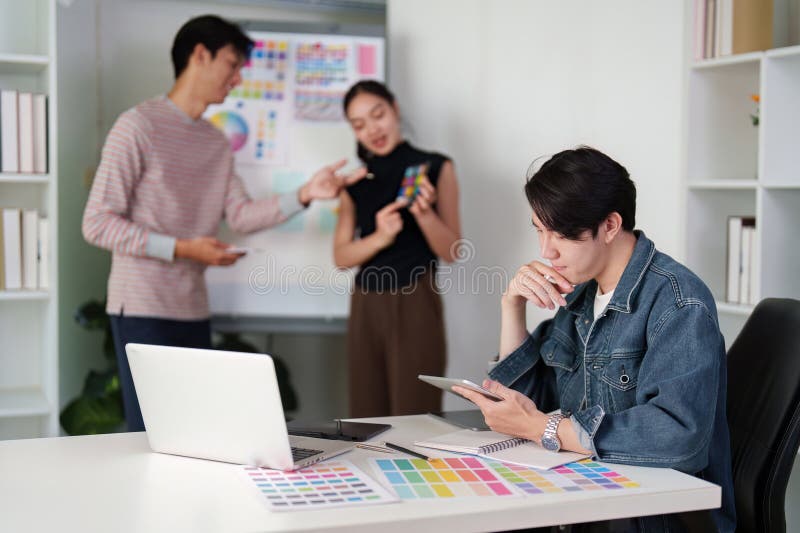 Creative Workflow and Inspiration. a Graphic Design Team Collaborating ...