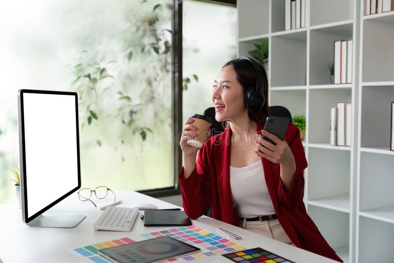 Creative Workspace and Digital Interaction. a Designer Multitasks with Coffee and Technology for ...