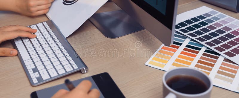 Creative Workspace with Hands Holding Sketch and Digital Tools, Color ...