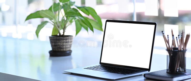 Creative Workspace with Laptop Computer, Pot Plant, Stationery and ...