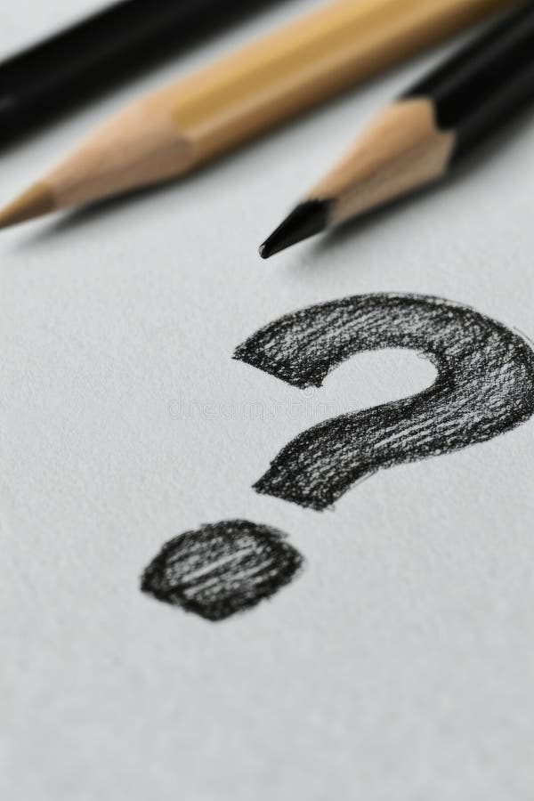 Creative Workspace with a Question Mark Drawn in Charcoal among Pencils ...