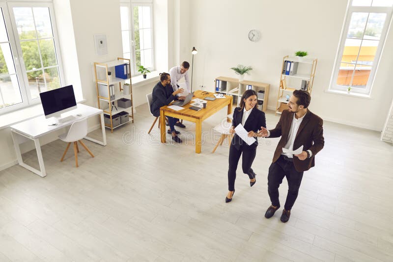 Creative Workspace with Young People Working on Projects, Sharing News ...