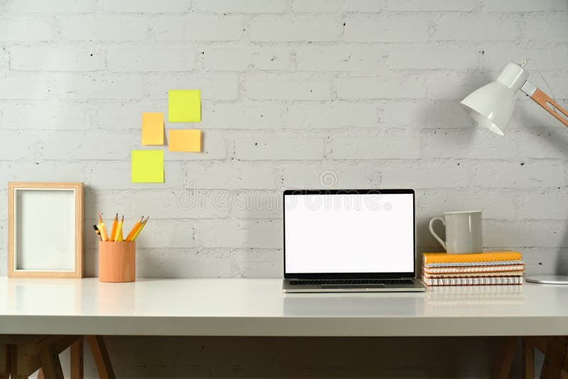 Creative Workstation with Laptop Computer, Pencil Holder, Books and ...