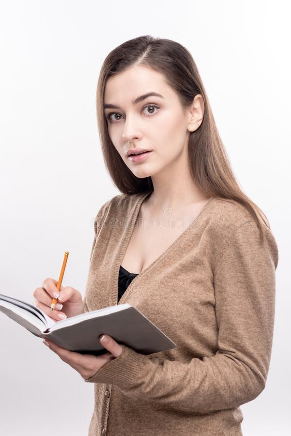Pleasant Young Woman Writing in Notebook Stock Image - Image of ...
