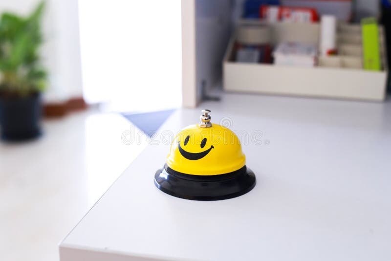 Creative Yellow Smiley Bell on Table, Smiley Bell Stock Image - Image ...