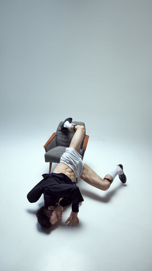 Creative Young Man, Dance Performer Entangled in Chair with Expressive ...