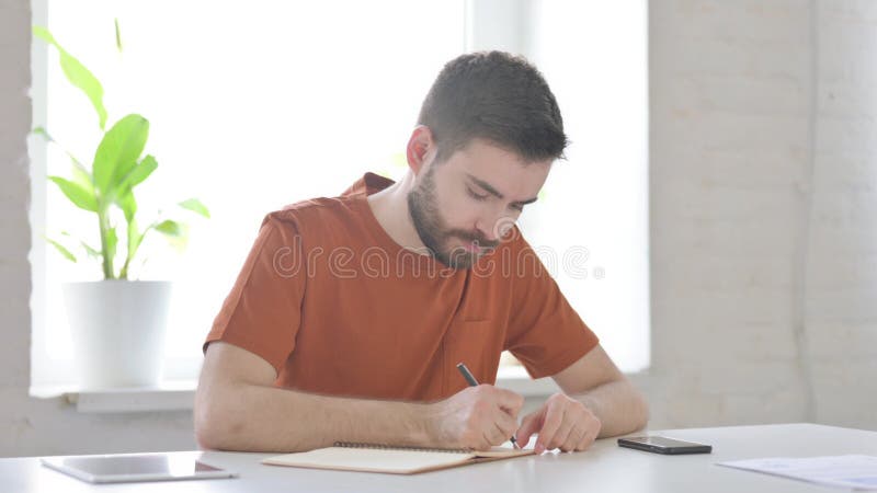 Young Man Writing Letter in Office Stock Photo - Image of writing ...