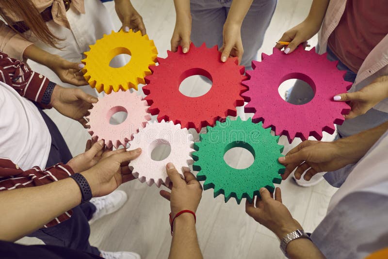 Creative Young People Hold Colored Gears of Different Sizes Symbolizing ...