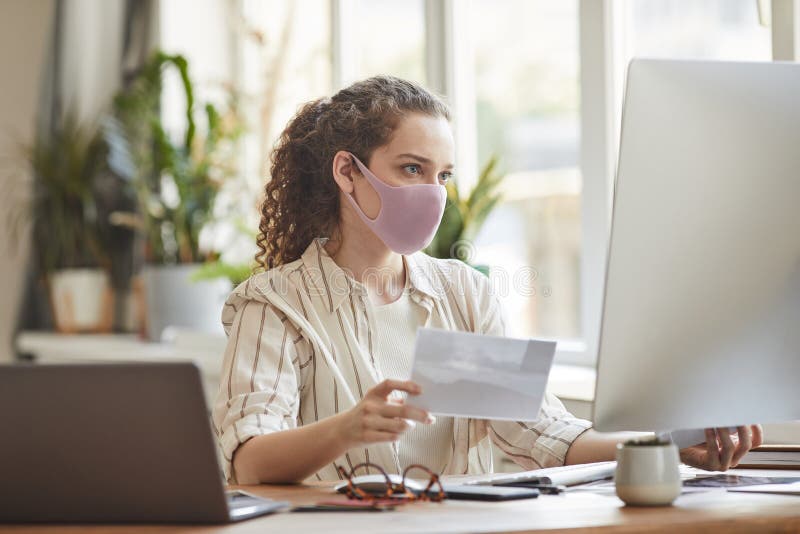 Creative Young Woman Wearing Mask in Office Stock Photo - Image of ...