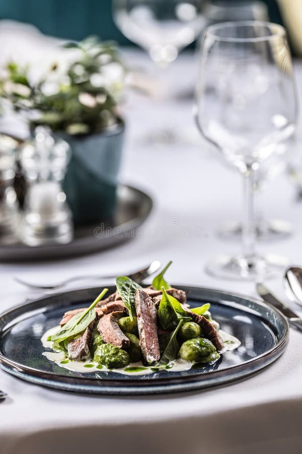 Creatively Cooked Beef Flank Steak with Spinach Gnocchi Served on a ...
